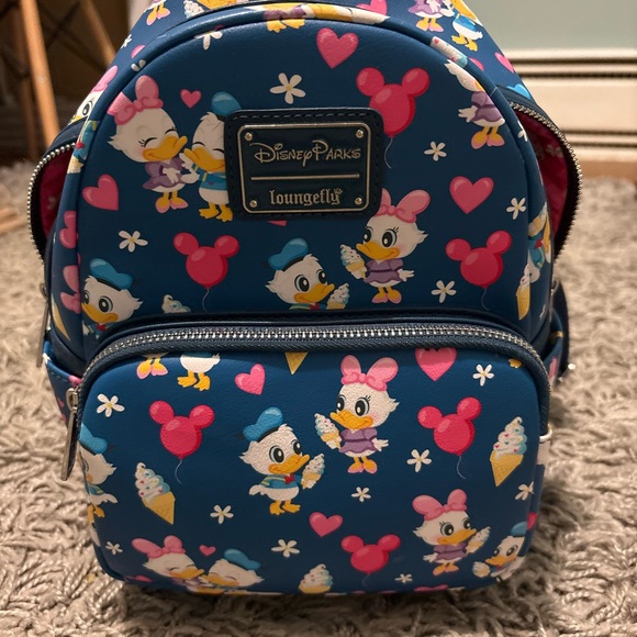 Loungefly | Bags | Loungefly Disney Parks Backpack Blue With Pink And ...